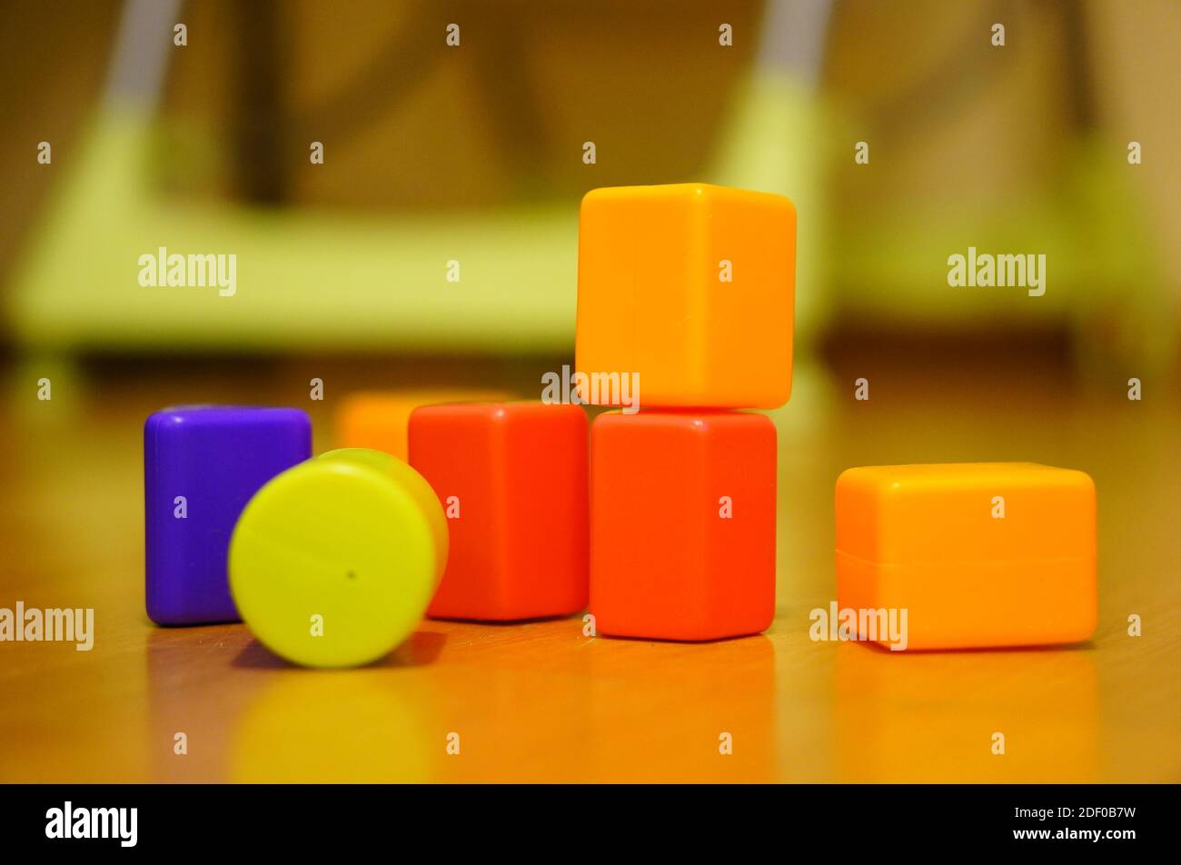 Blue, green and orange cubes and circles next to each other Stock Photo ...