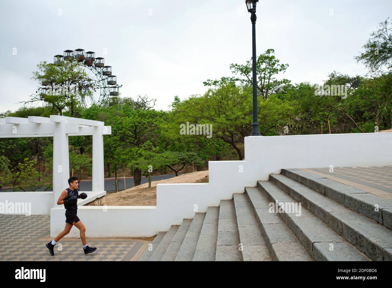 White caucasian boxer with black boxing gloves running on stairs Stock ...