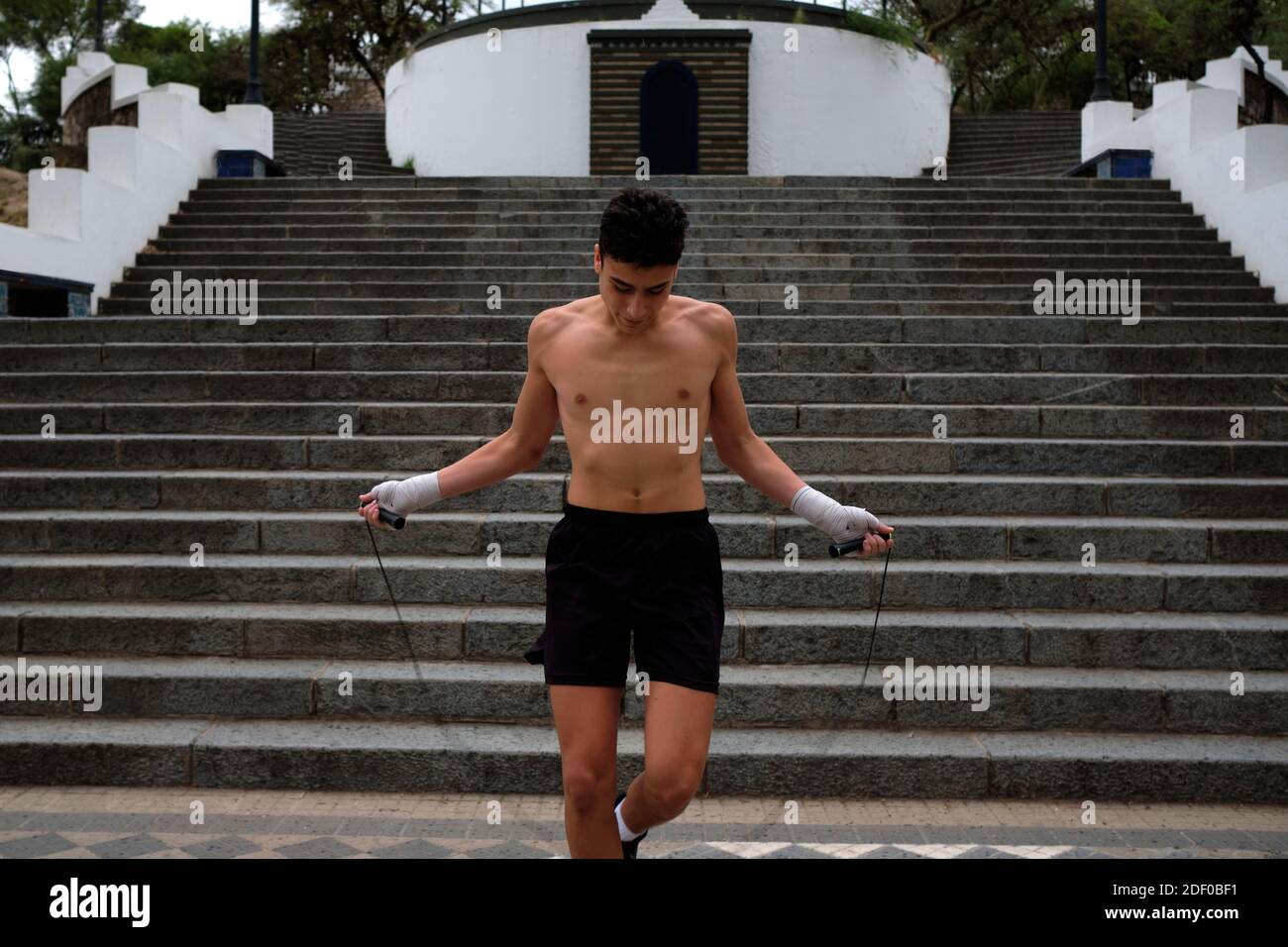 White caucasian boxer with black boxing gloves running on stairs Stock ...