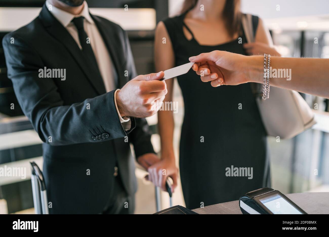 Receptionist standing in hotel lobby hi-res stock photography and ...