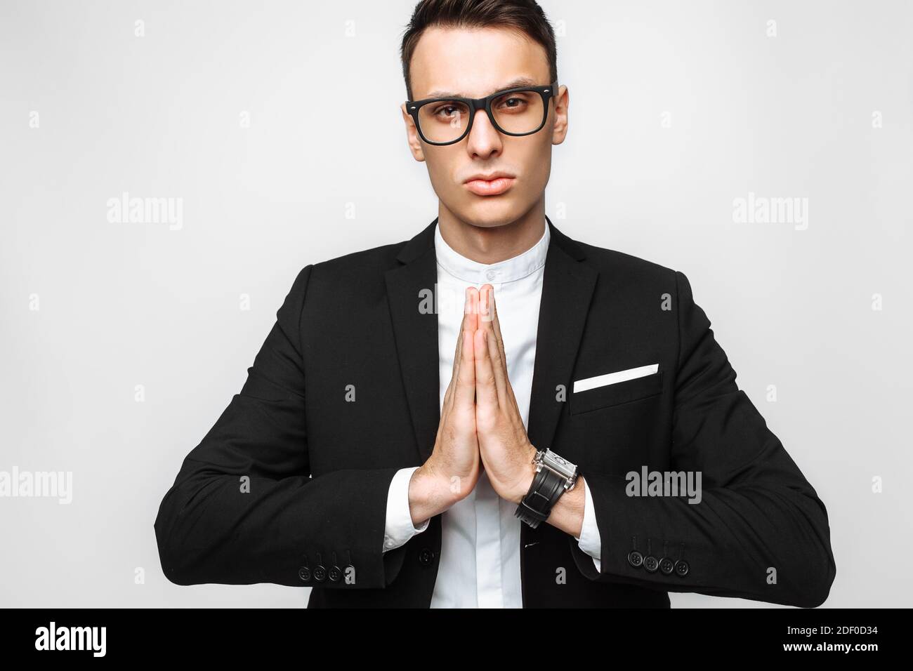 Portrait of a handsome young business man, male, in a classic black ...