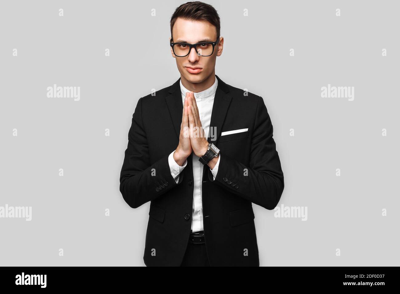 Portrait of a handsome young business man, male, in a classic black ...