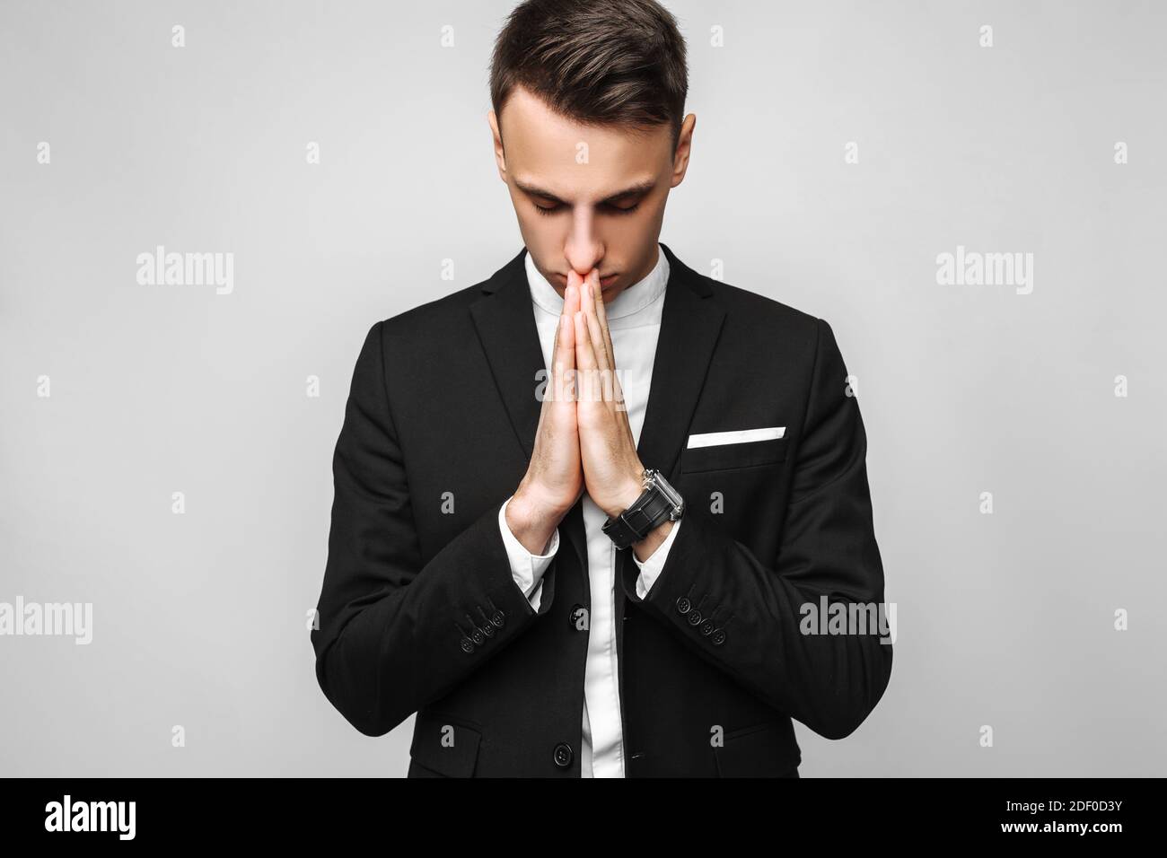 Portrait of a handsome young business man, male, in a classic black ...