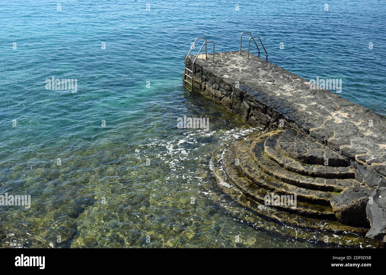 Stone pier with steps into sea Playa Blanca Lanzarote Stock Photo - Alamy