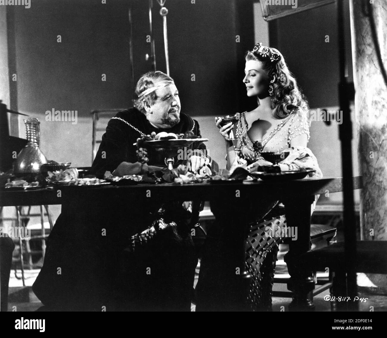 CHARLES LAUGHTON as King Herod and RITA HAYWORTH on set candid during ...