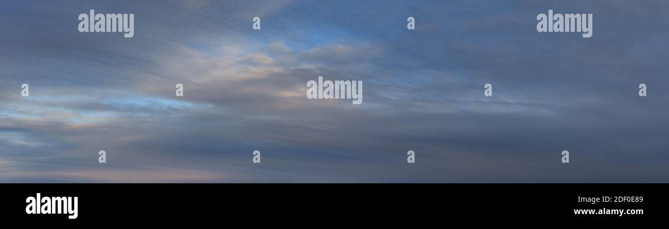 Fluffy clouds in evening overcast sky panoramic view. Climate ...