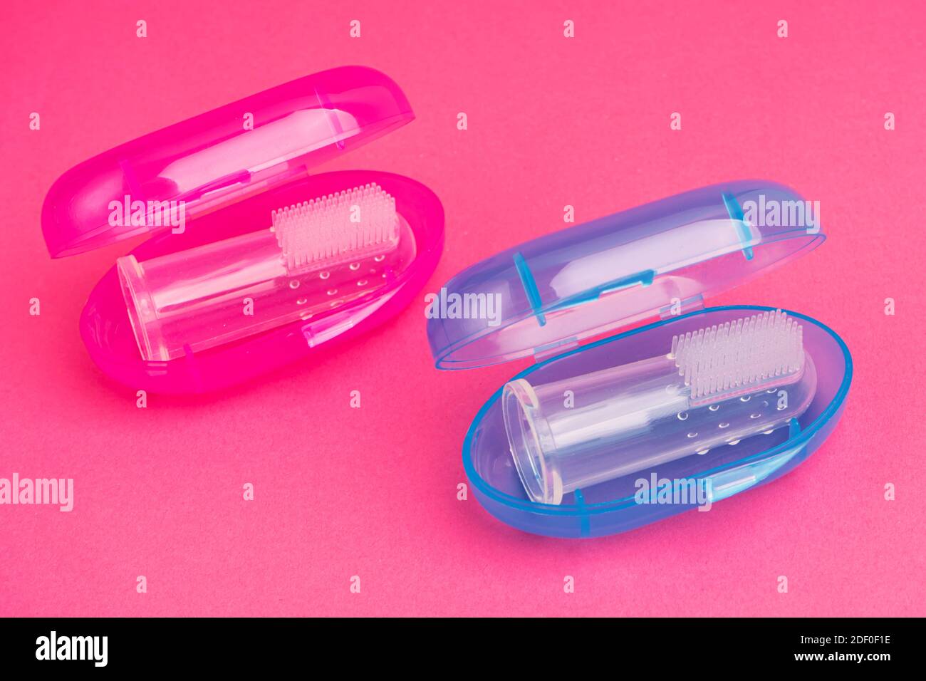 Compact toothbrush fingertip. Travel hygiene Stock Photo - Alamy