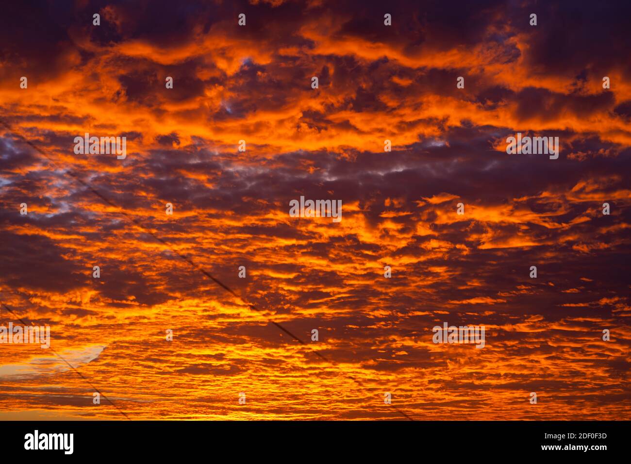 The colors of a burning sunset in the sky Stock Photo - Alamy