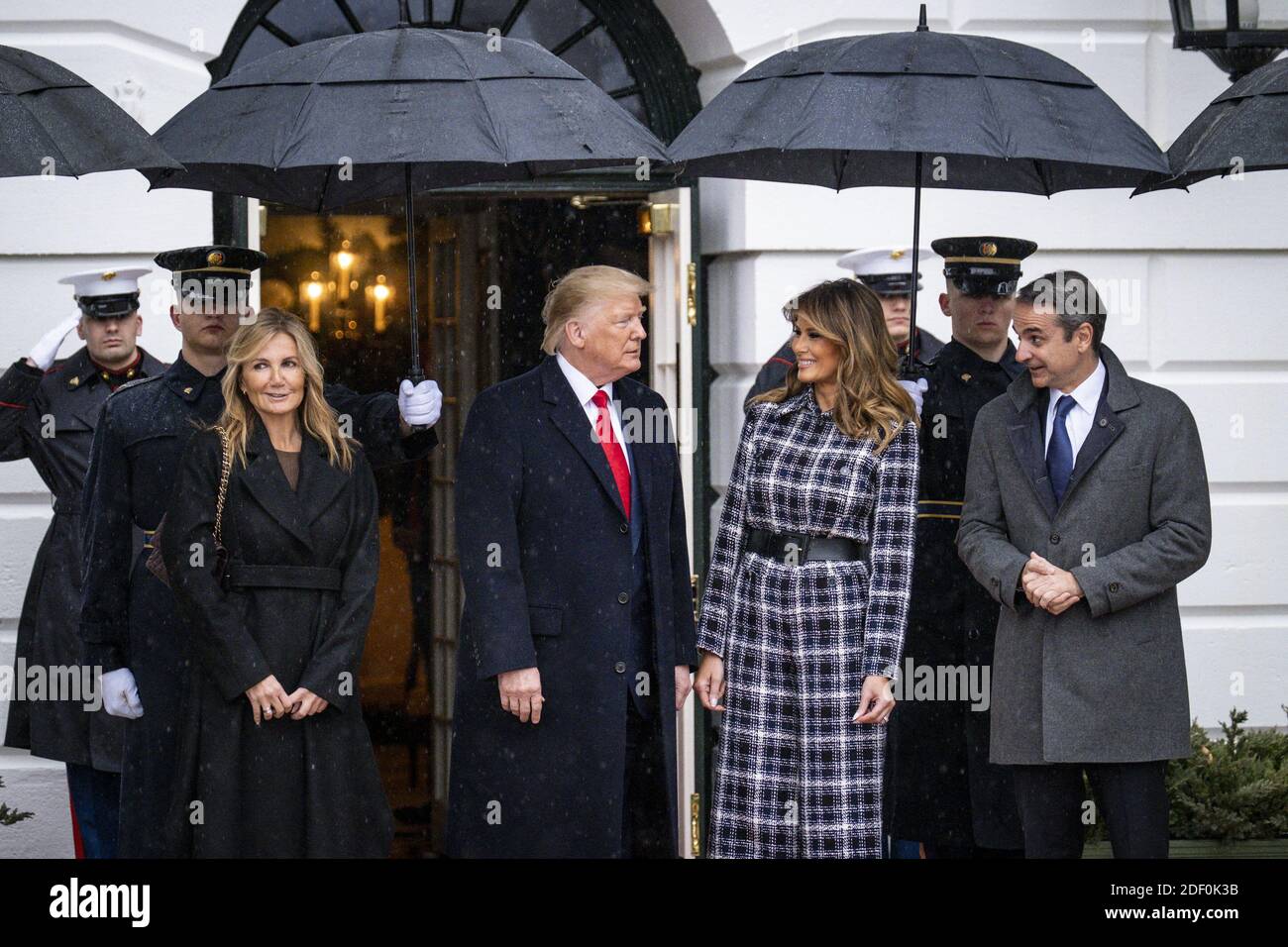 President Donald Trump (center left) and First Lady Melania Trump ...