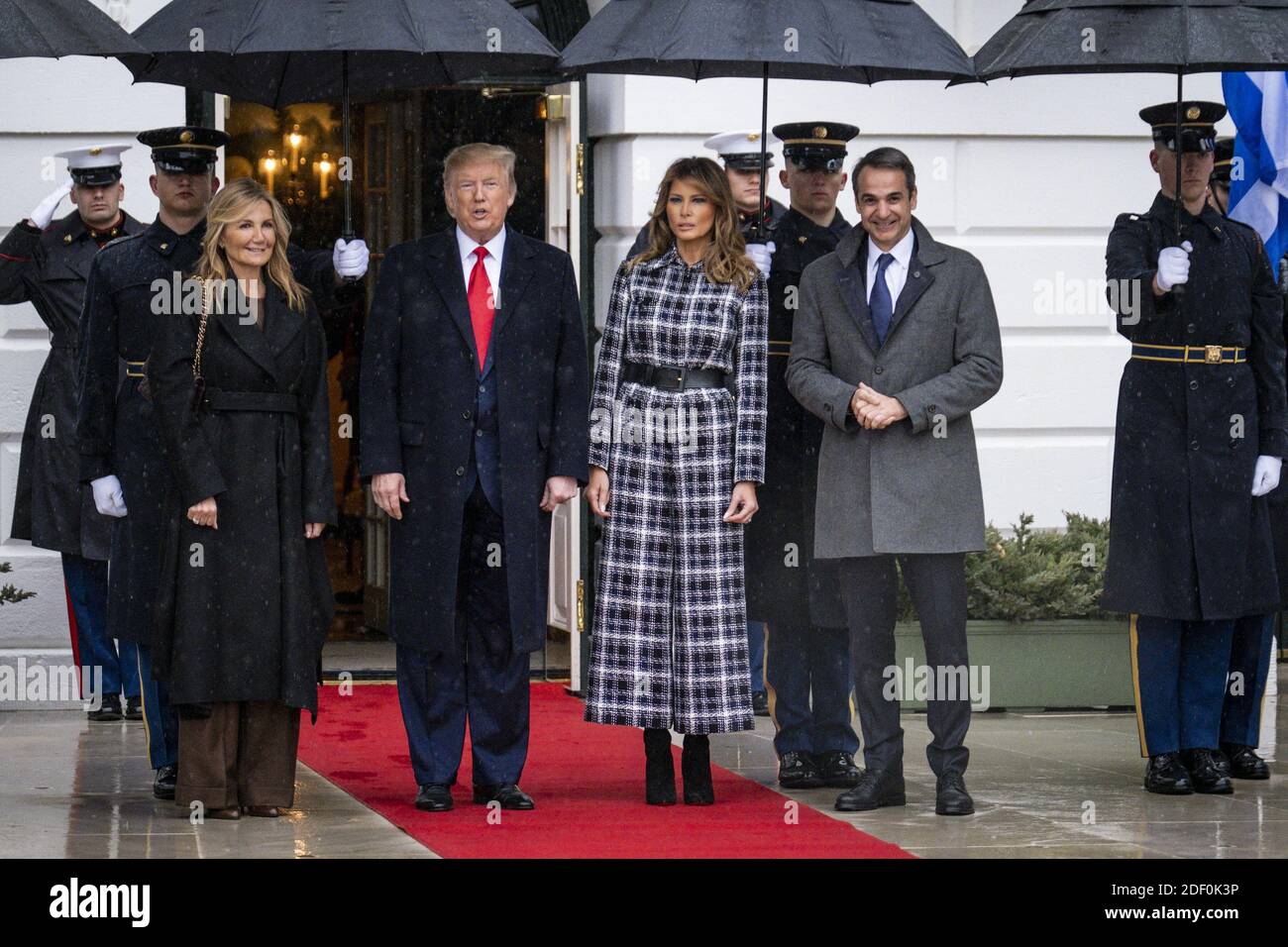 President Donald Trump (center left) and First Lady Melania Trump ...