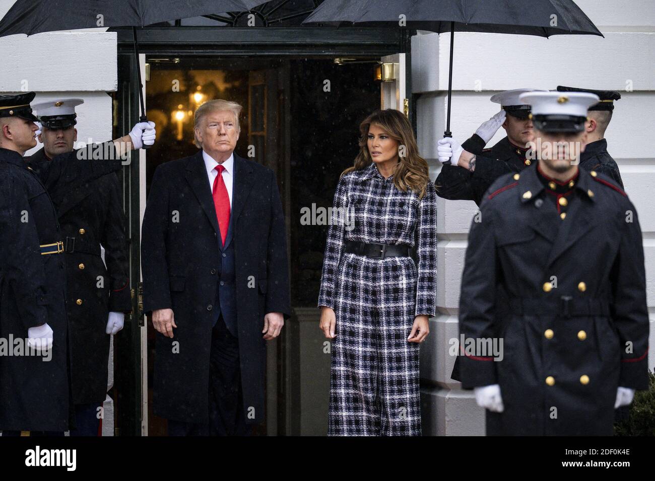 President Donald Trump and First Lady Melania Trump wait to greet Greek ...