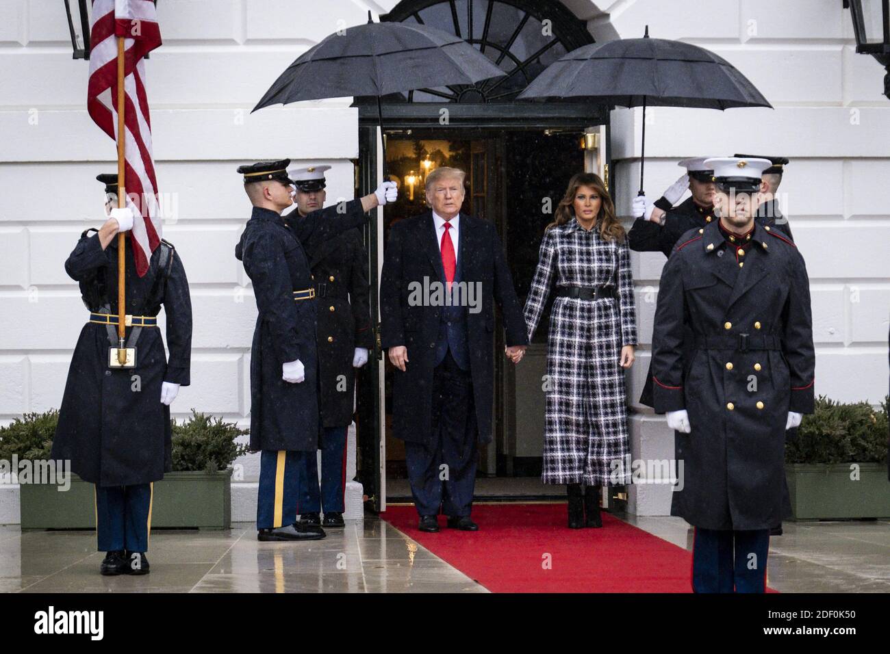 President Donald Trump and First Lady Melania Trump wait to greet Greek ...