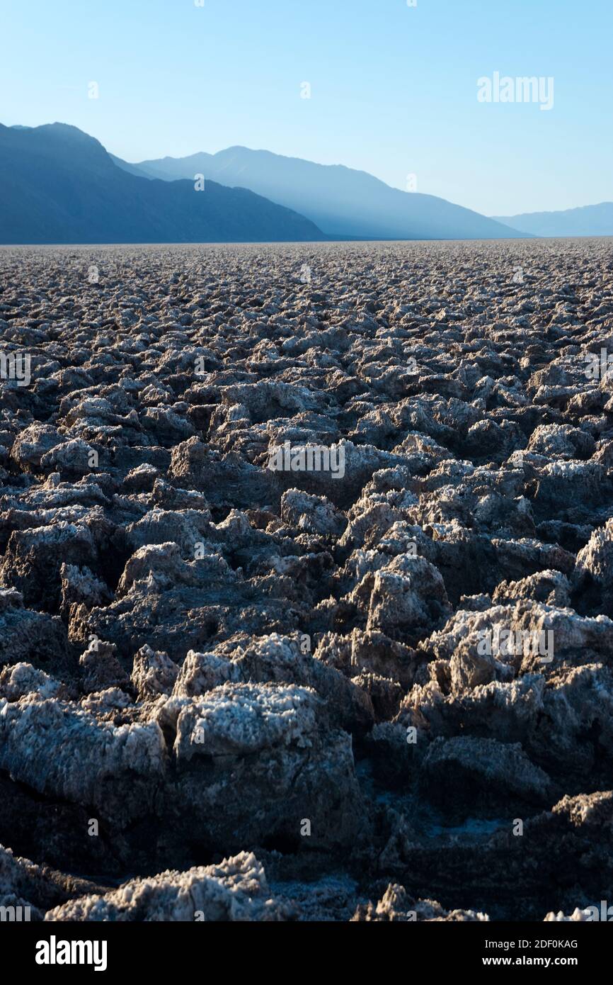 Coarse salt deposits cover the Devil's Golf Course, a large salt pan on ...