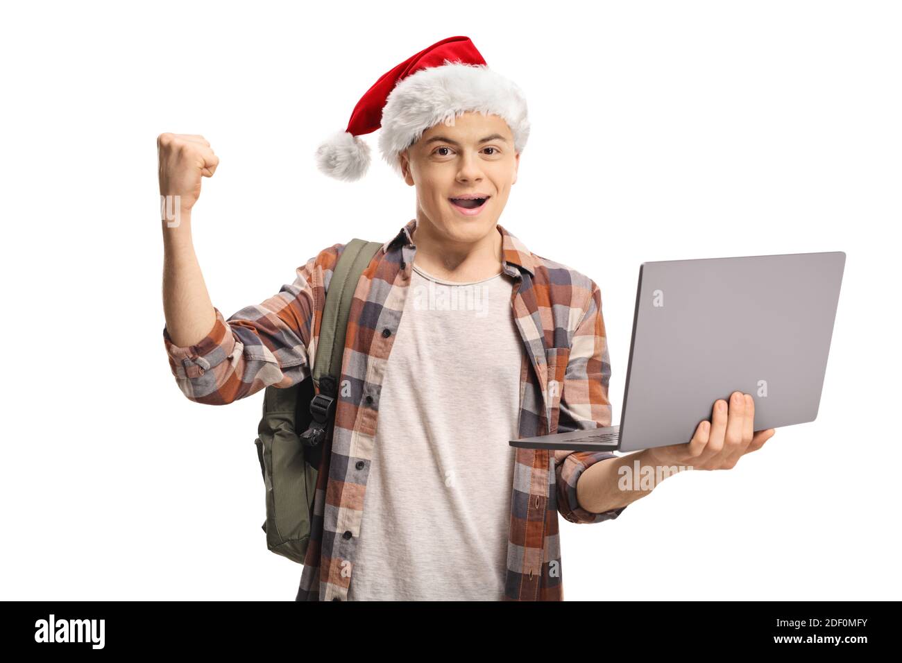 Happy student with a santa claus hat holding a laptop and gesturing ...