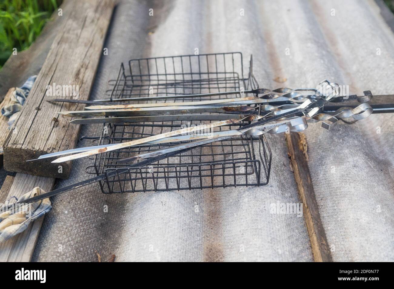 Old Dirty rusty skewers and barbecue grill Stock Photo - Alamy
