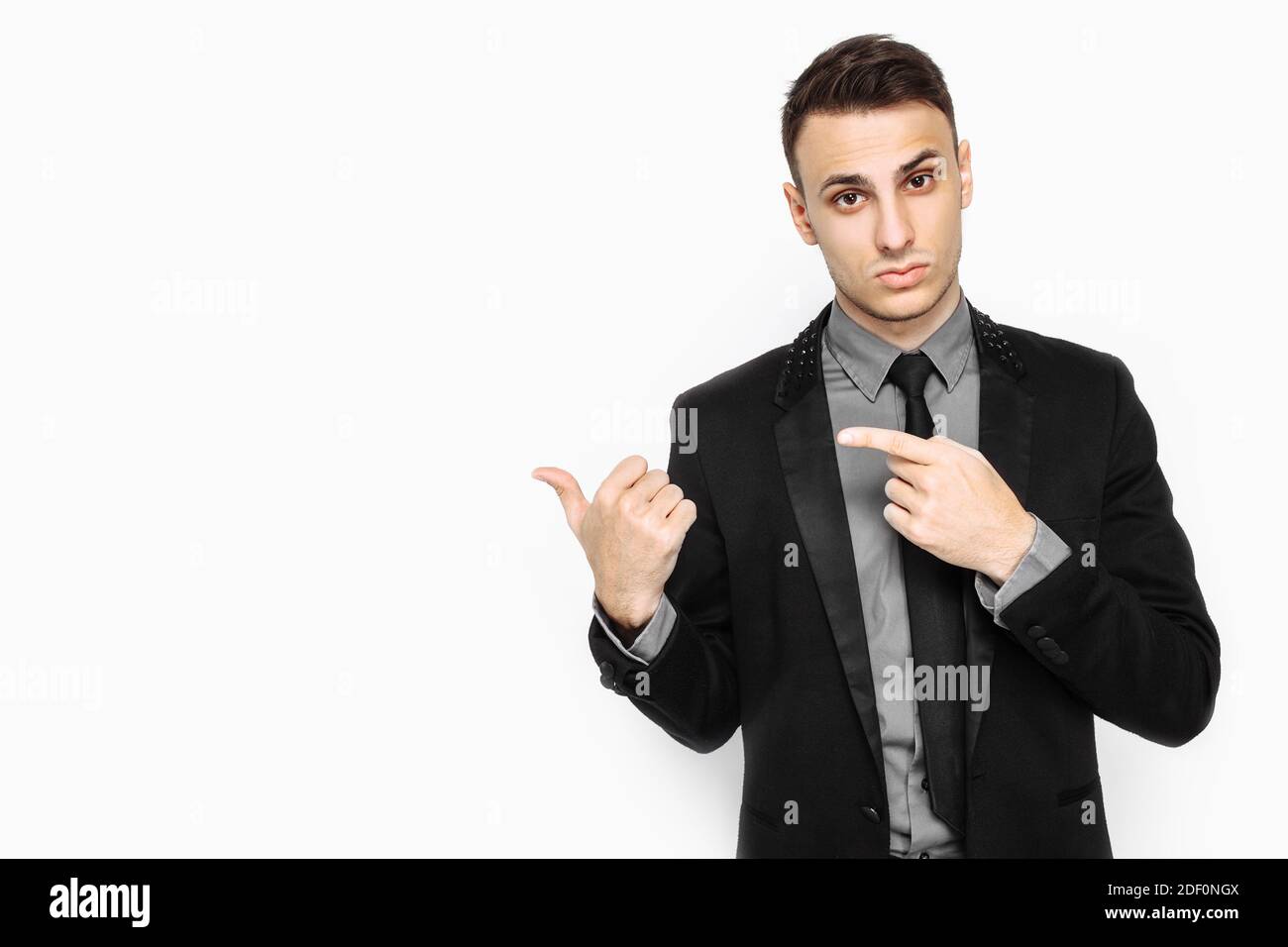 Portrait of an authoritative masculine man, confident, pointing to an ...