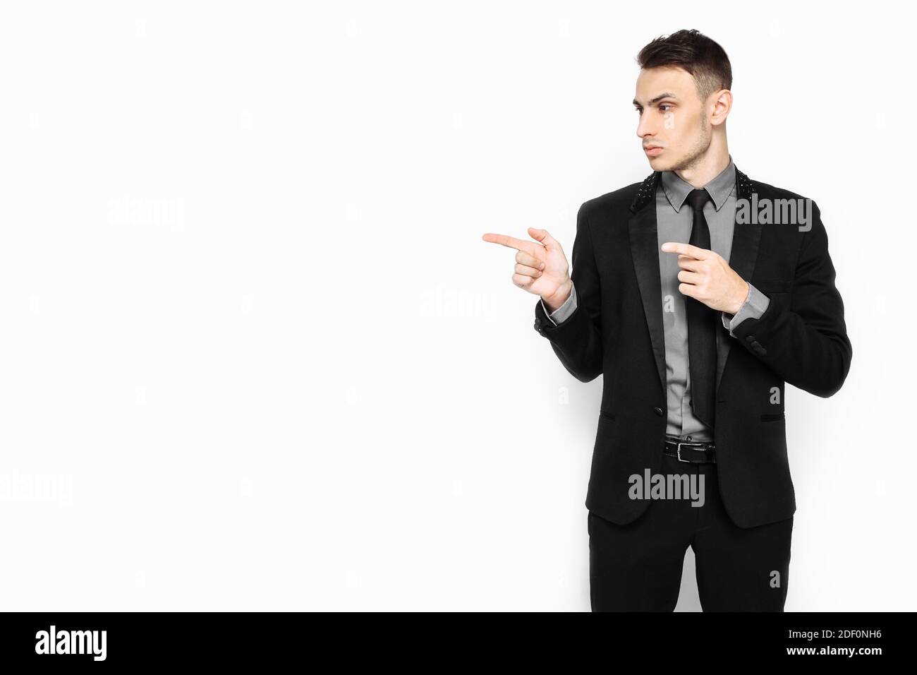 Portrait of an authoritative masculine man, confident, pointing to an ...