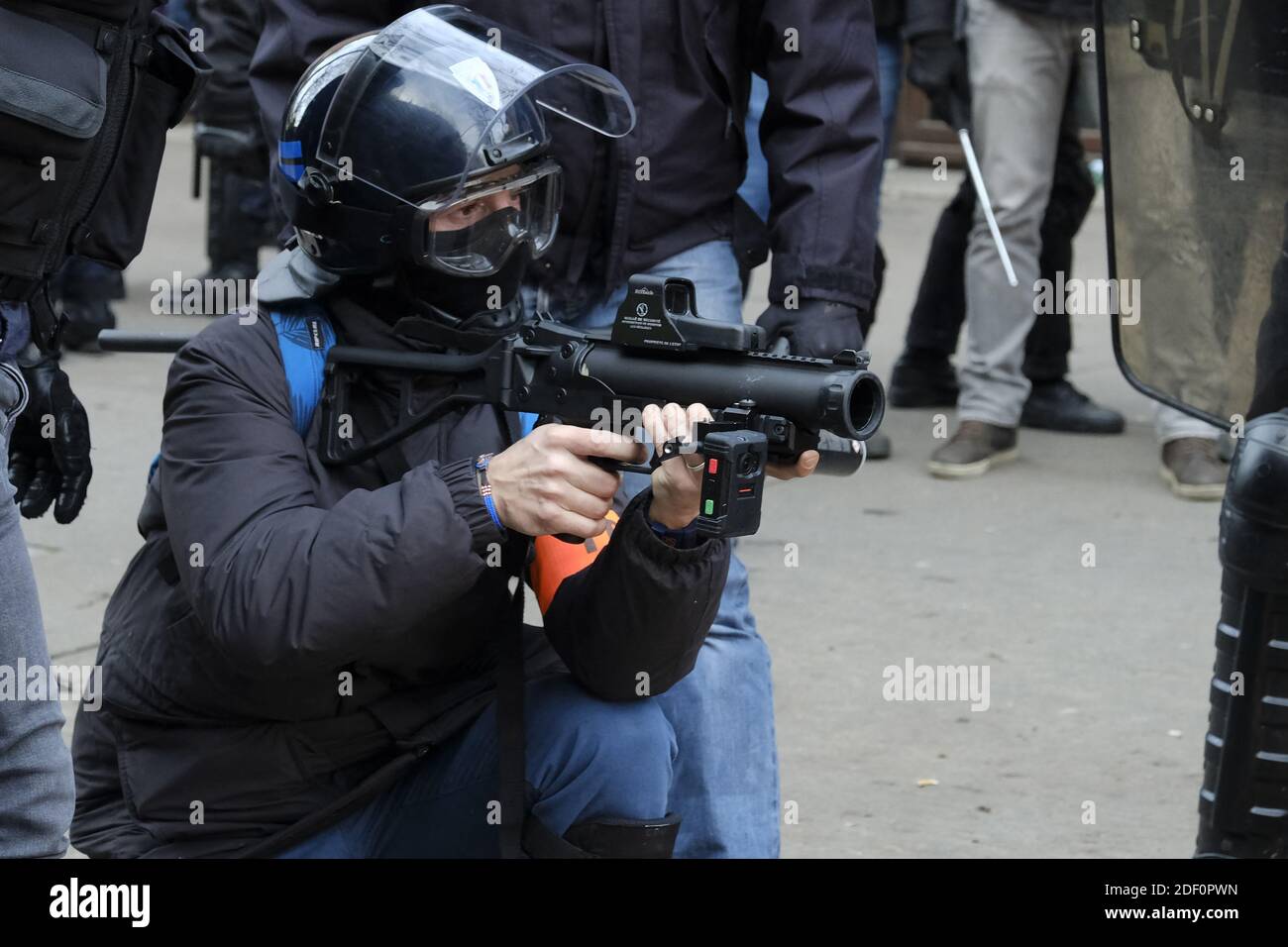 French riot police armed with LBD 40, Flash-Ball (non-lethal rubber ...