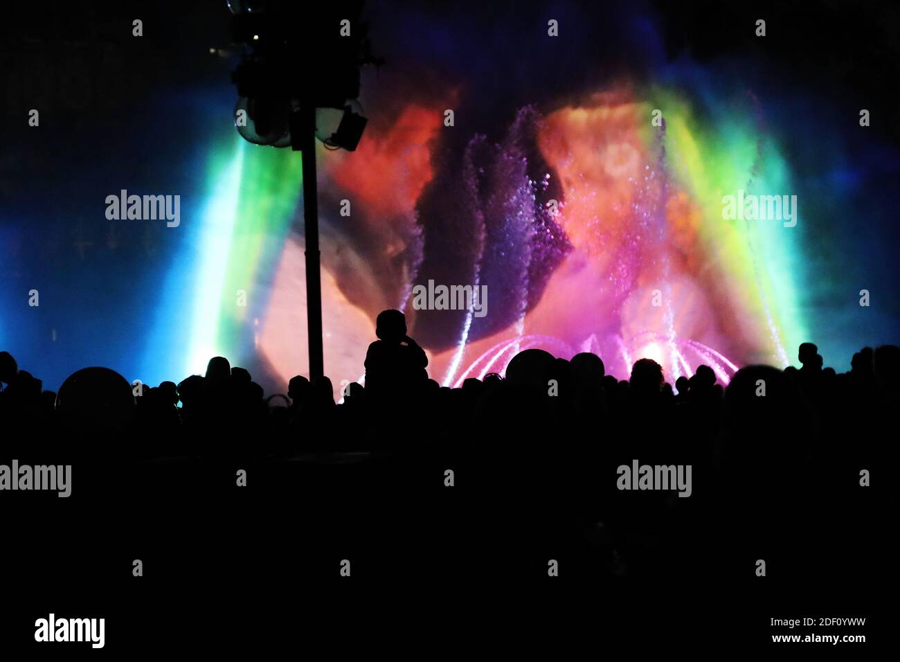 Pyrotechnic light show with crowd silhouetted against the light Stock ...
