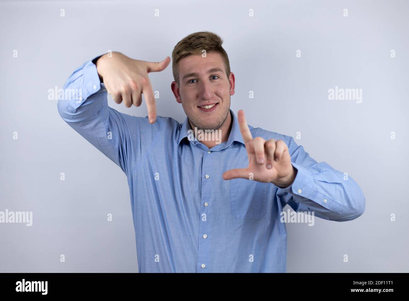 Business young man wearing a casual shirt over white background smiling ...