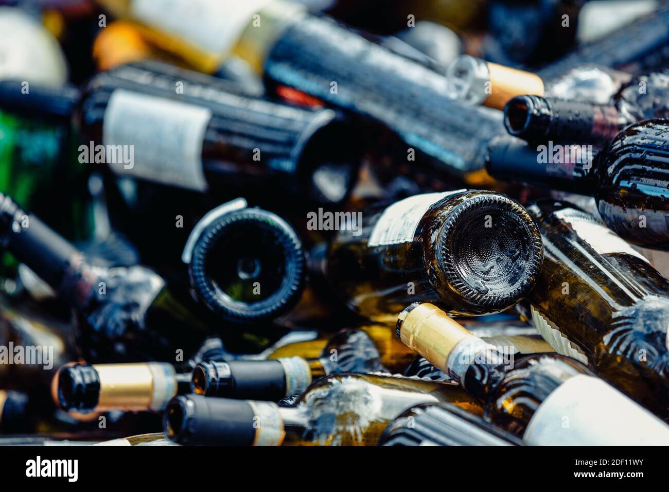 A large heap of empty wine bottles. Garbage. Recycle concept. Ecology ...
