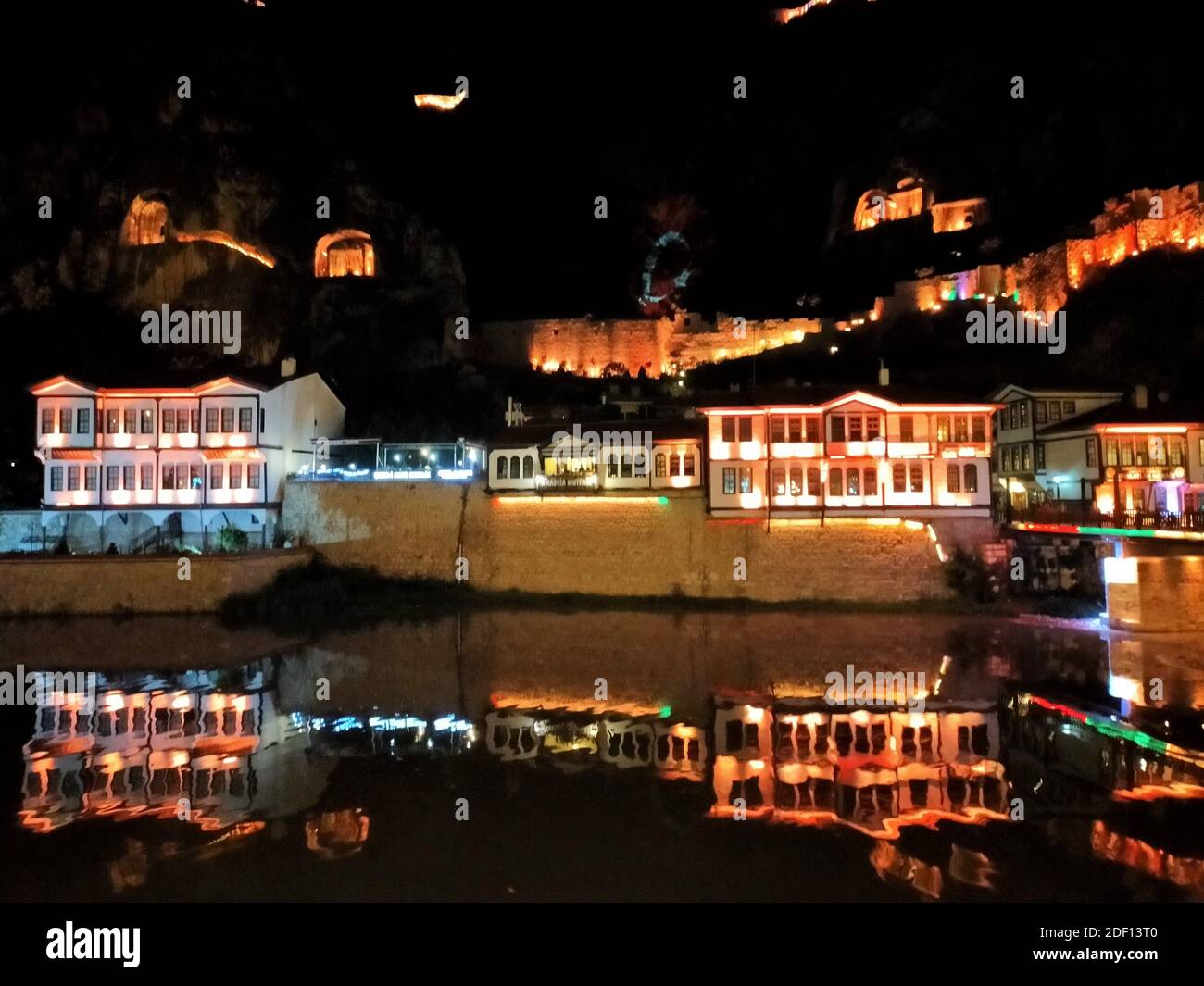 Traditional Amasya houses by Kizilirmak River at night. Historical ...