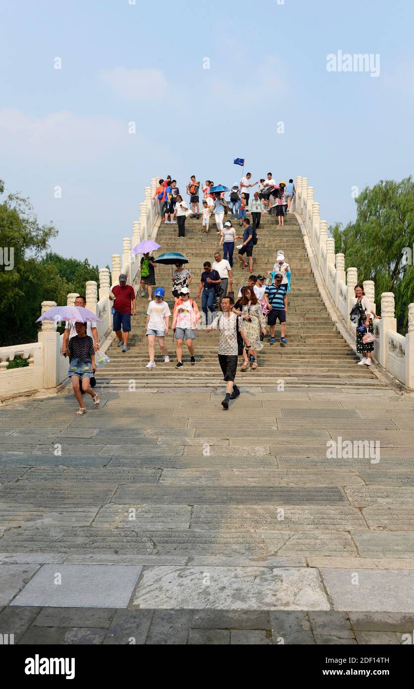 Many visitors cross the humpback Jade Belt bridge, built in the mid ...