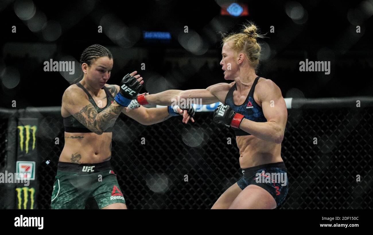 Holly Holm (red gloves) vs. Raquel Pennington (blue gloves) at T Mobile ...