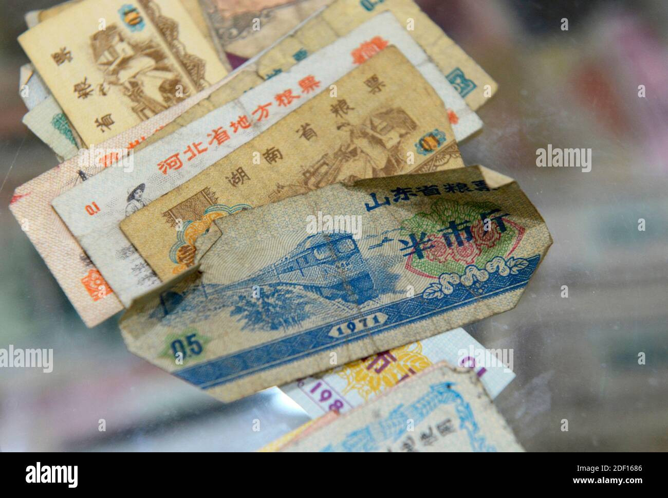 Ration tickets for rice on show at a market in western Beijing, China ...