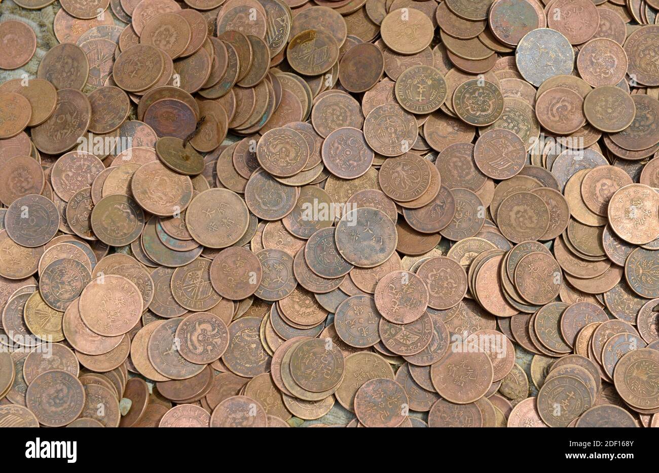 Many old coins on show at an antiques market in western Beijing, China ...