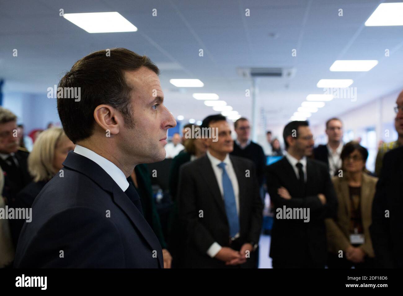 French president Emmanuel Macron profile as he visits the laboratory of ...