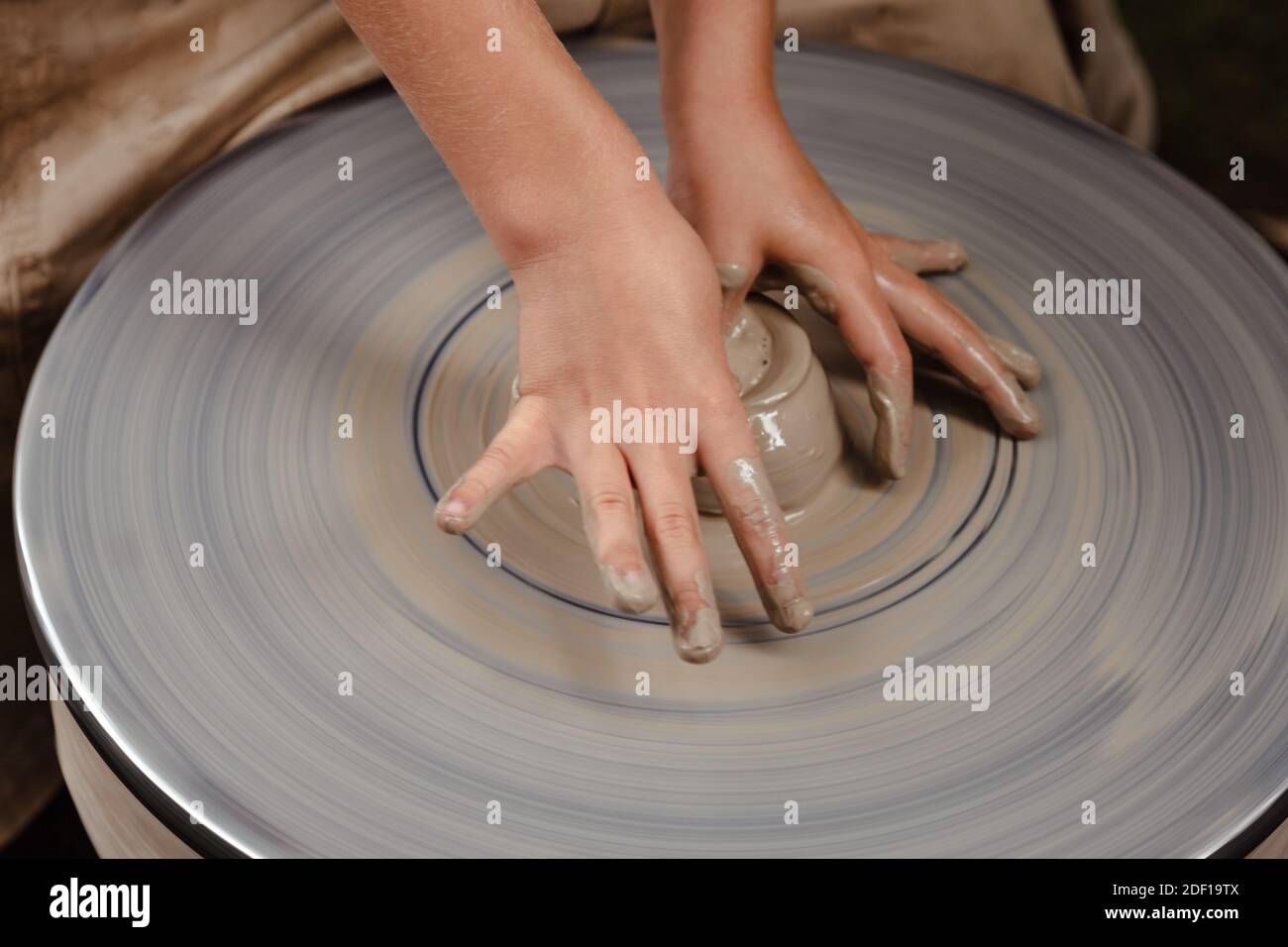 Rotating potter's wheel and clayware on it taken from above. A sculpts ...