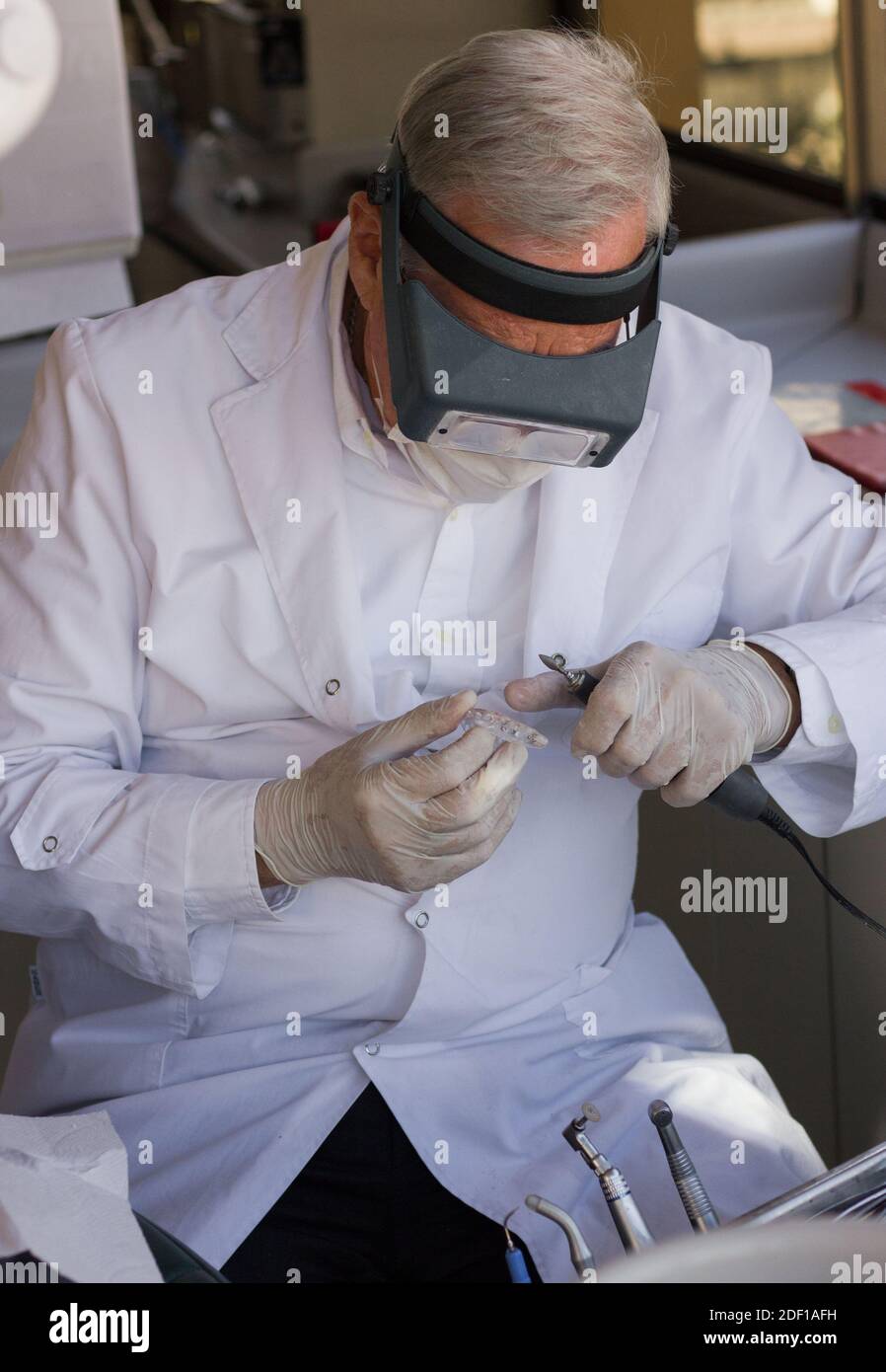 Dentist wearing latex gloves hi-res stock photography and images - Alamy