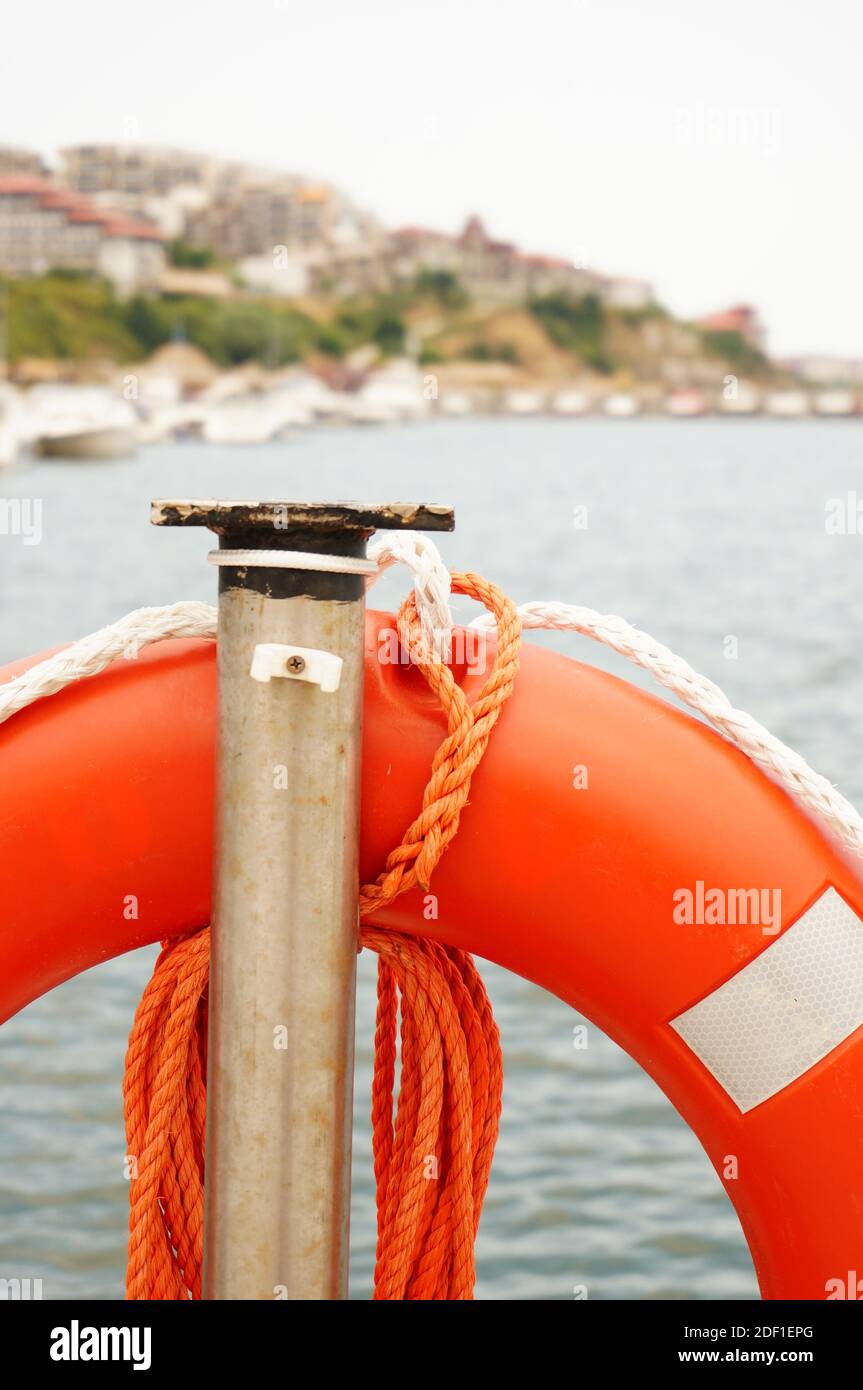 The Lifebuoy Or Life Preserver attached to the metal tube with ropes ...
