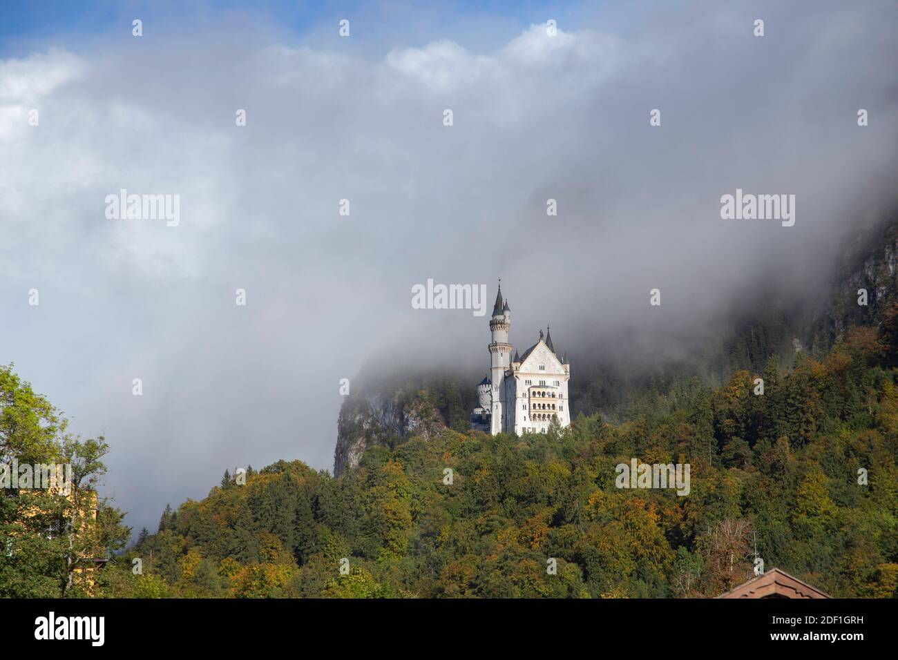 A side view of castle Neuschwanstein through the clouds Stock Photo - Alamy