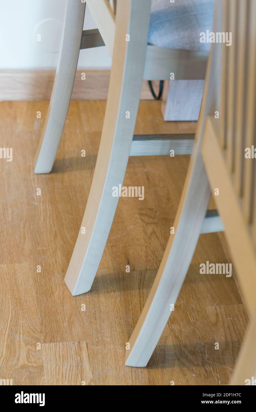 A vertical shot of a leg of a chair on the floor Stock Photo - Alamy