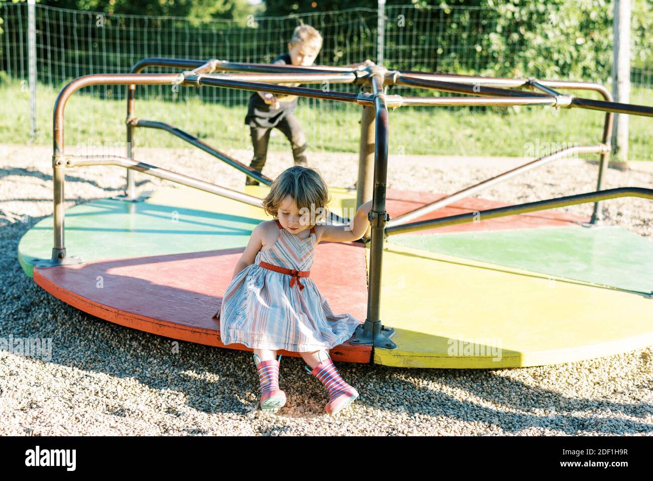 Kids merry go round playground hi-res stock photography and images - Alamy