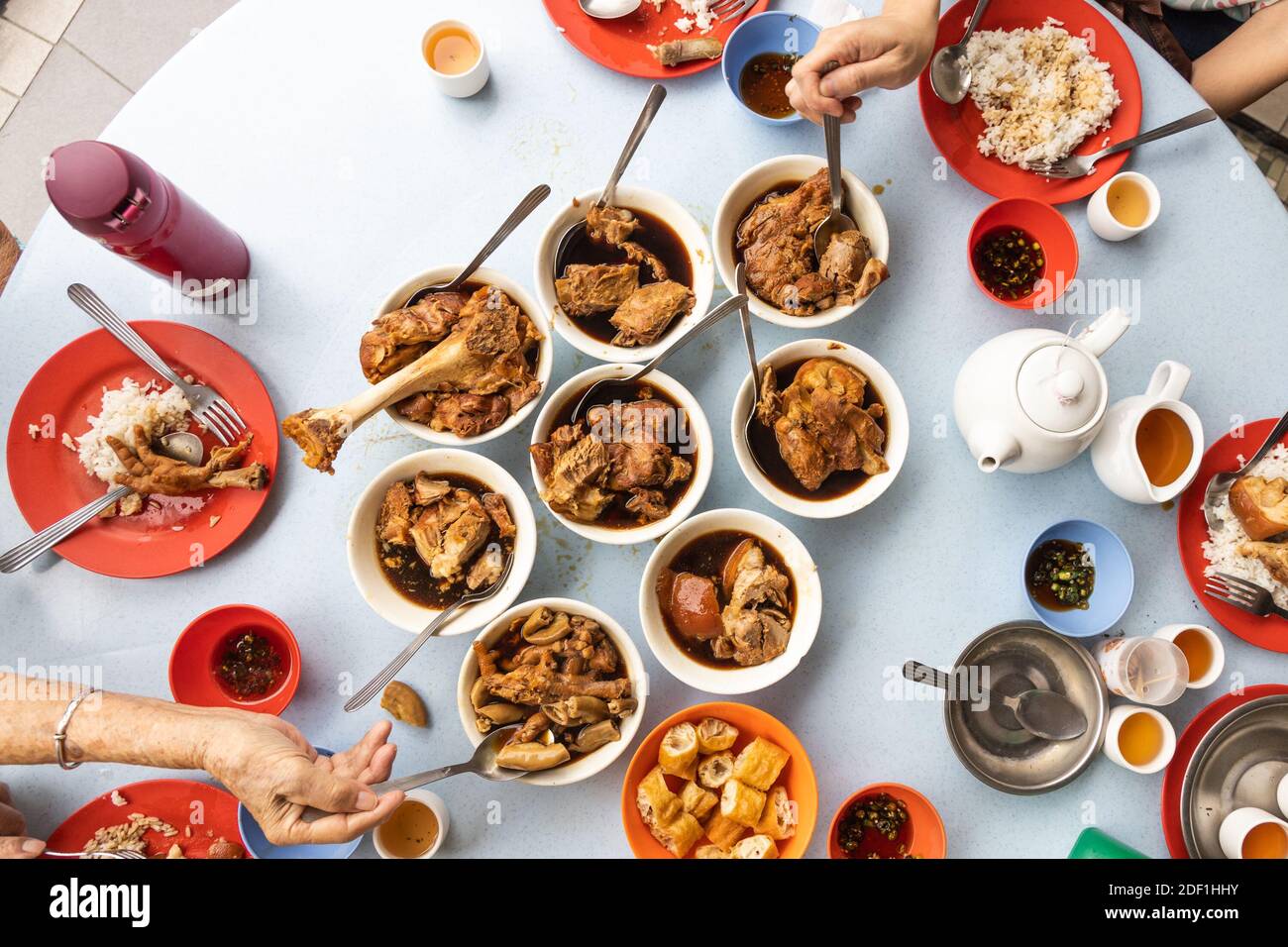People eating variety of authentic bak kut teh, popular Chinese food in ...