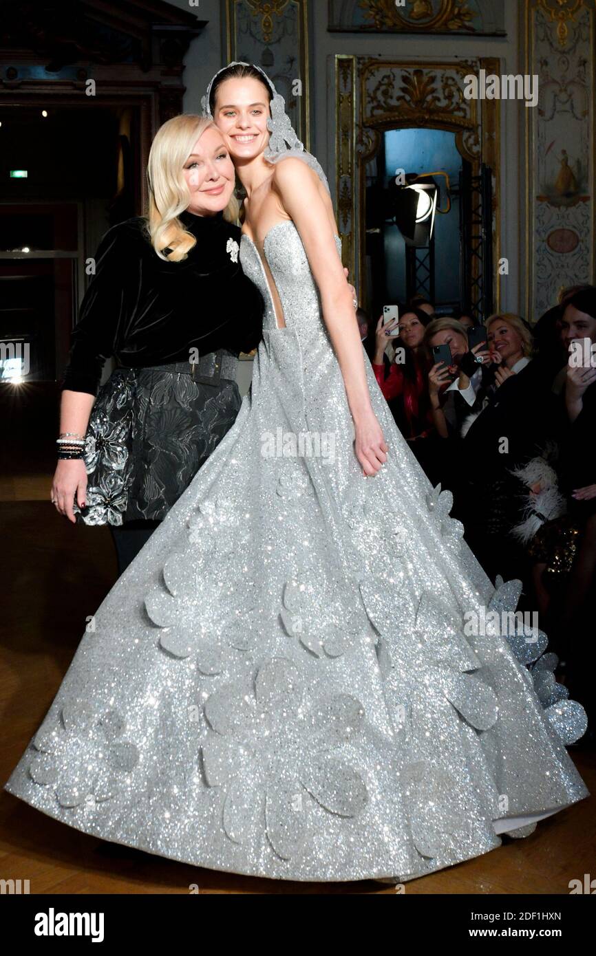 Designer Yanina and a model walk the runway during the Yanina Haute ...