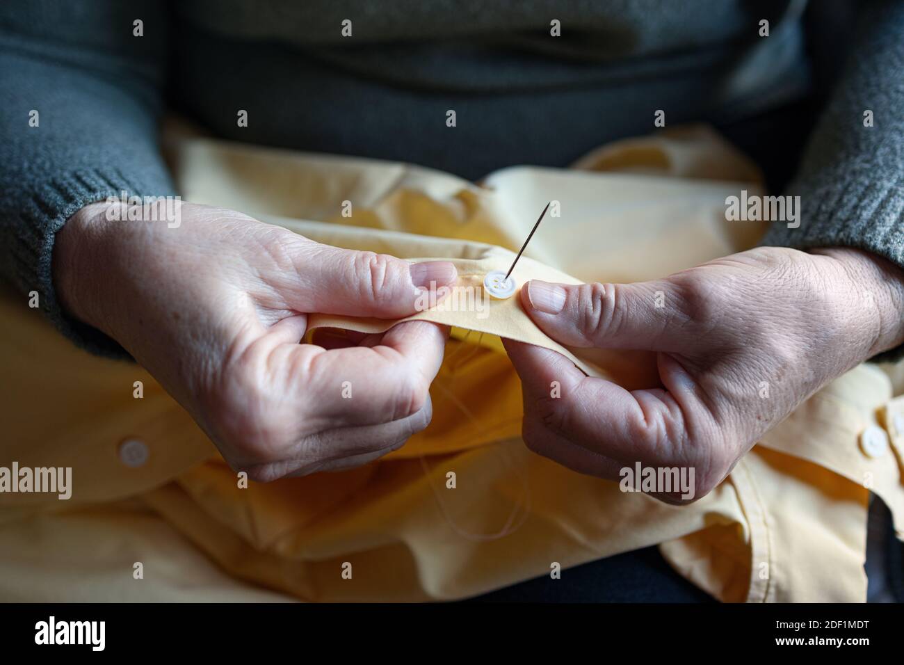 Old woman sewing hi-res stock photography and images - Alamy