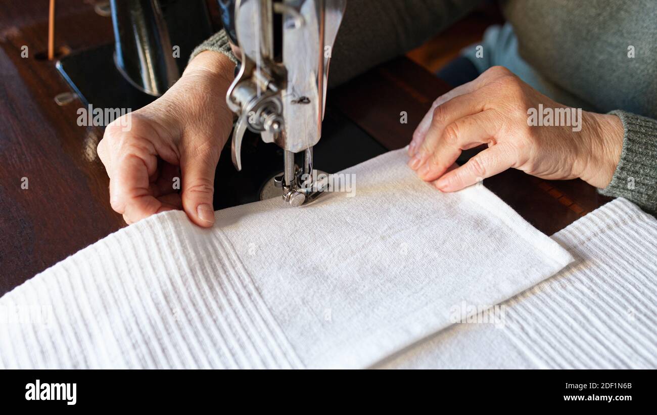 Woman using sewing machine home hi-res stock photography and images - Alamy
