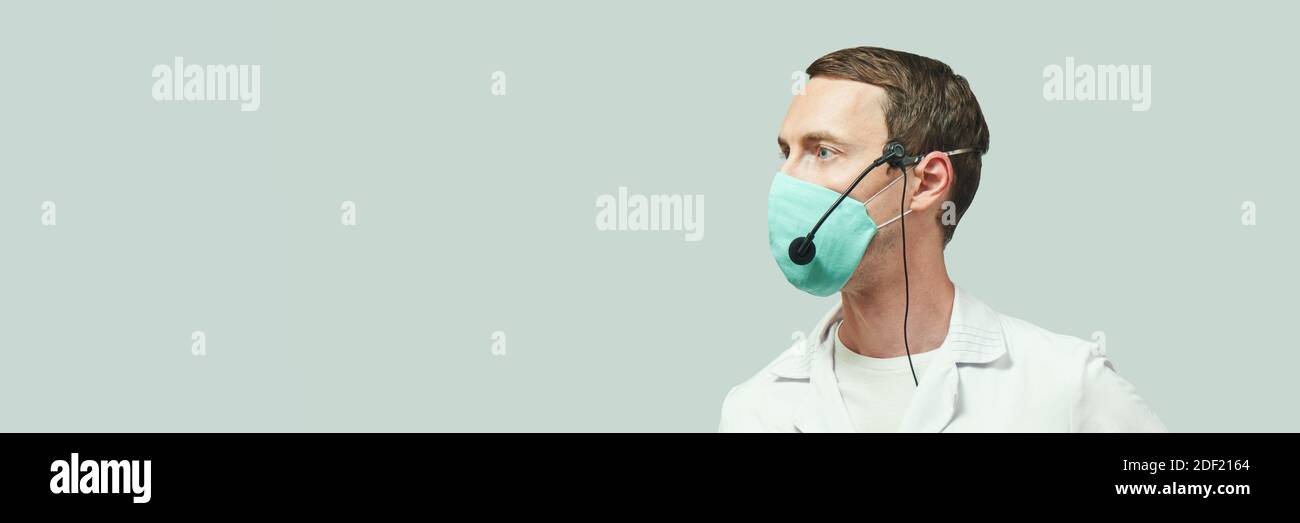 Male doctor with headphones. Studio Medicine portrait Stock Photo - Alamy