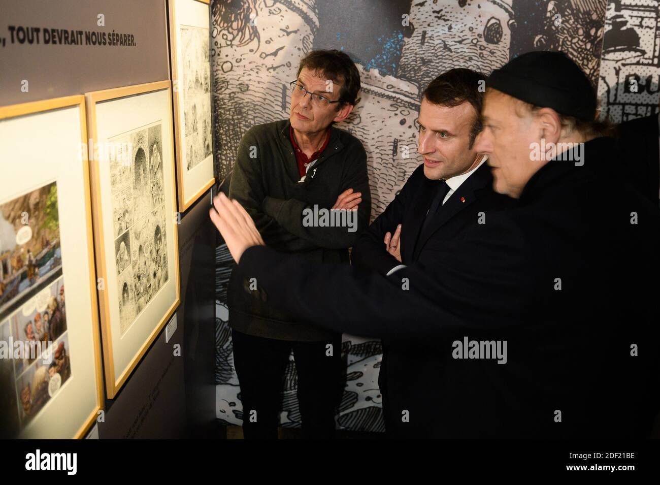 President Emmanuel Macron, here with cartoonists Christin and Enki ...