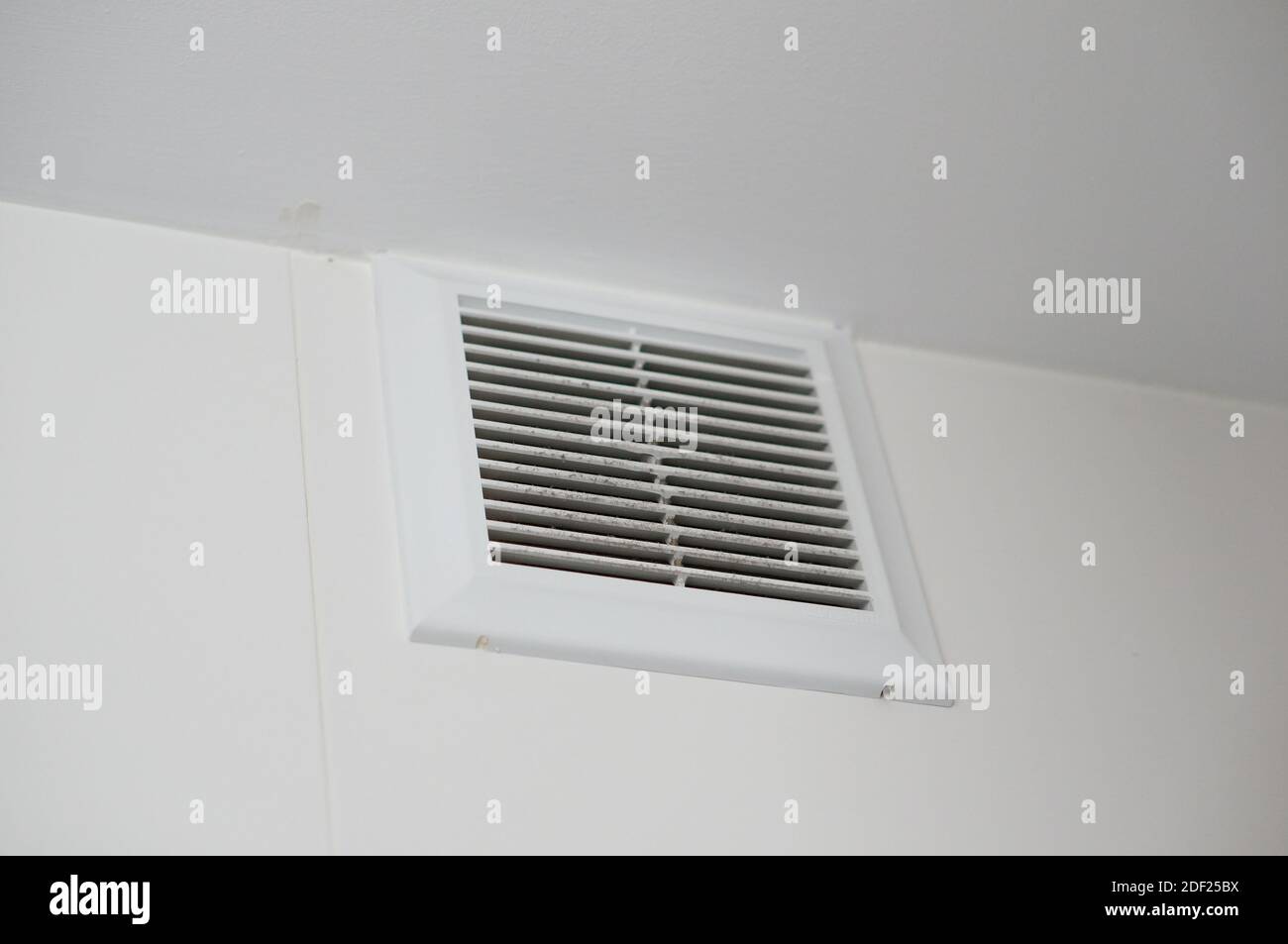 A low angle shot of a white air vent on the wall Stock Photo - Alamy