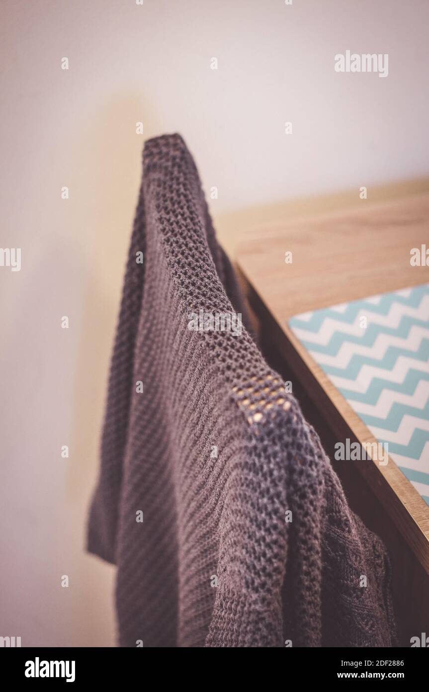 Clothes draped on chair hi-res stock photography and images - Alamy