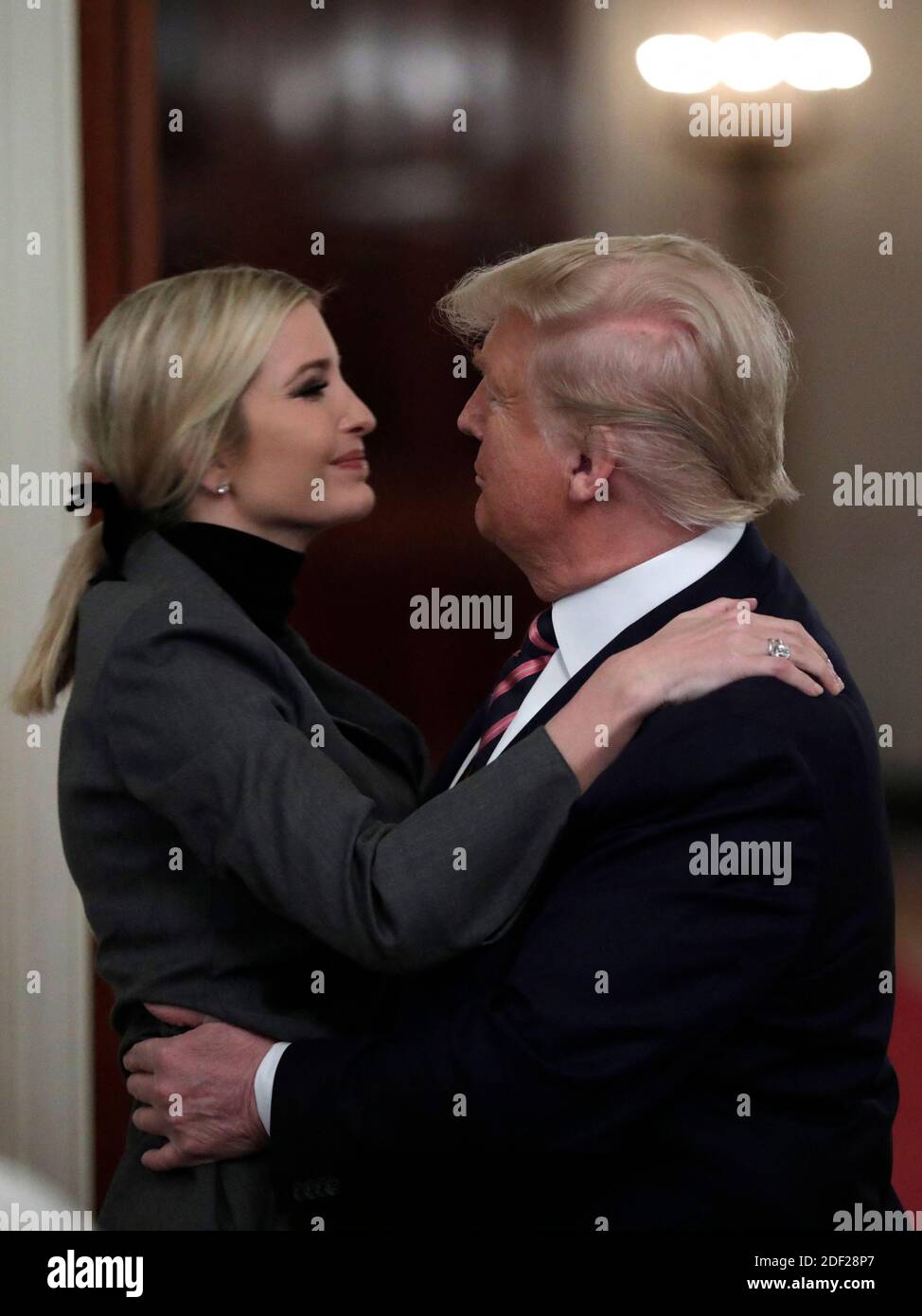 U.S. President Donald Trump hugs his daughter Ivanka Trump after ...
