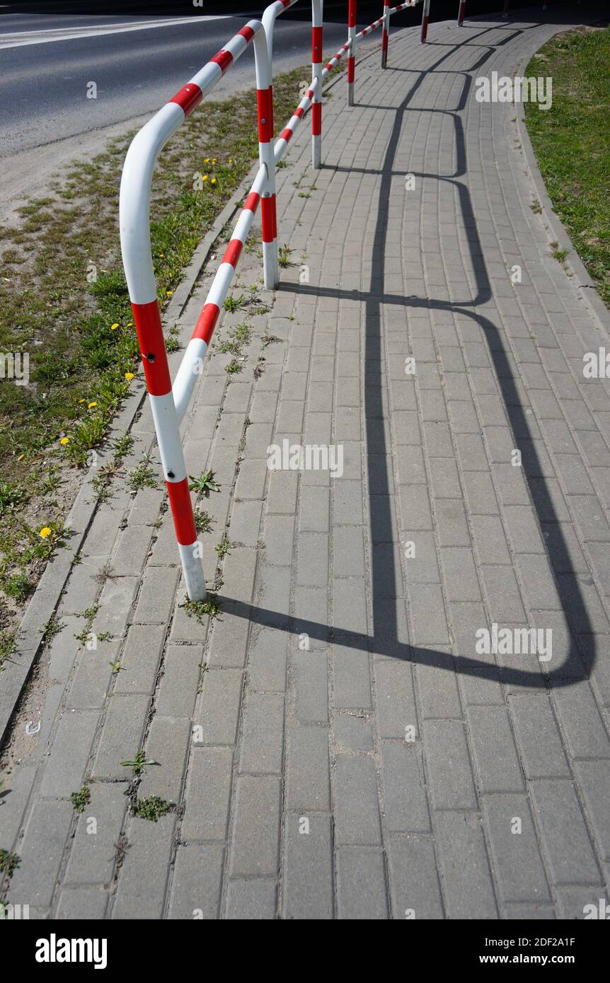 A vertical shot of a pathway with a metal railing Stock Photo - Alamy