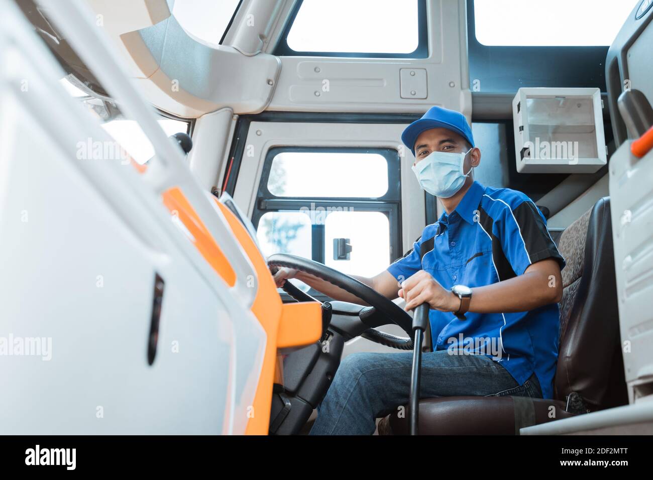 portrait of asian bus driver wearing uniform and mask Stock Photo - Alamy