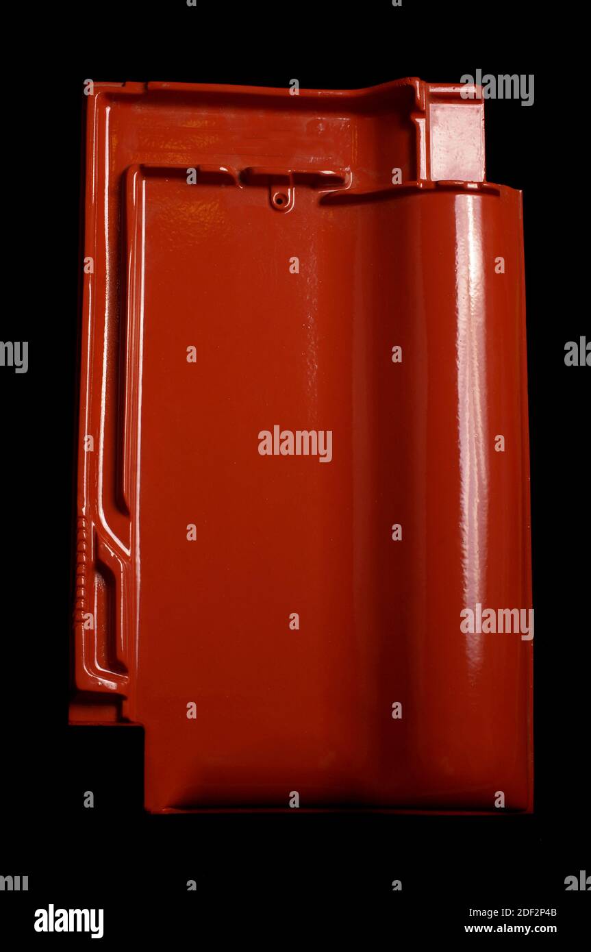 Single new shinny red roof tile isolated on the black background Stock ...