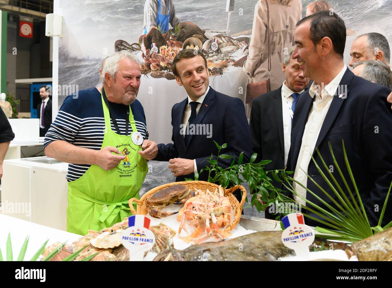 A guest, Emmanuel Macron and Eric Bothorel. French President Emmanuel ...